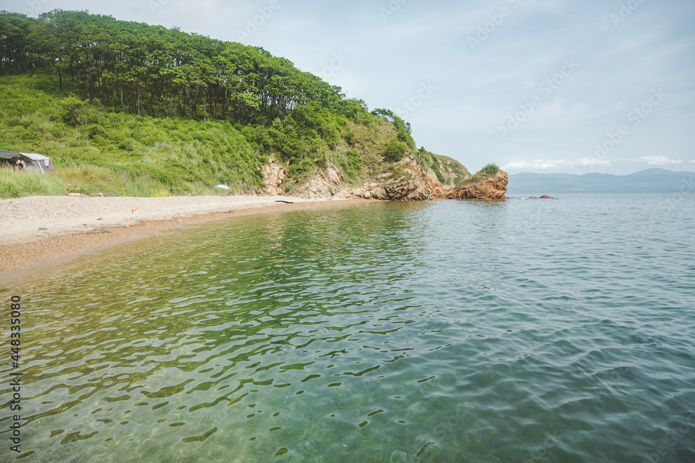 summer azure clear sea panorama. shallow transparent sea with reefs ...