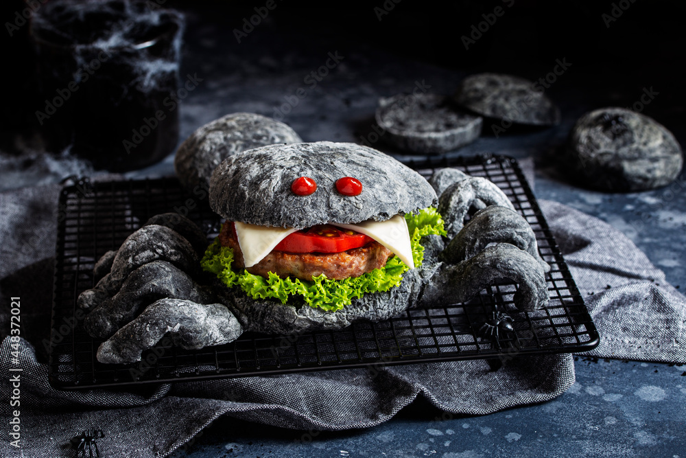 Scary hamburger with black dough bun in the shape of a spider for the ...