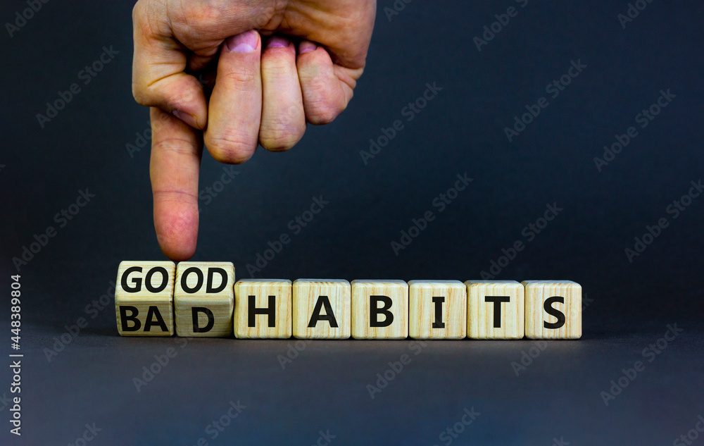 Good or bad habits symbol. Businessman turns wooden cubes and changes ...