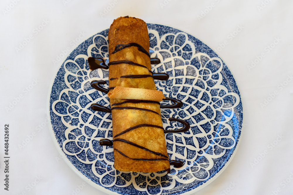 Crepe plate with a wafer stick and a chocolate drizzle. Top view Stock ...