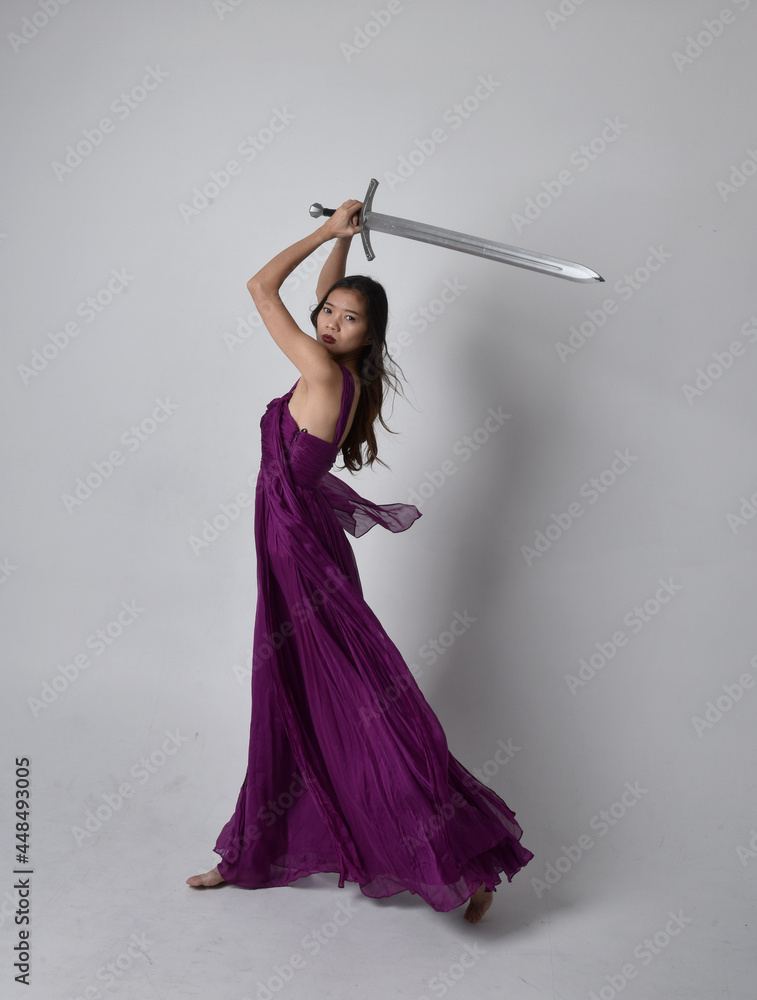 Full length portrait of pretty brunette asian girl wearing purple ...
