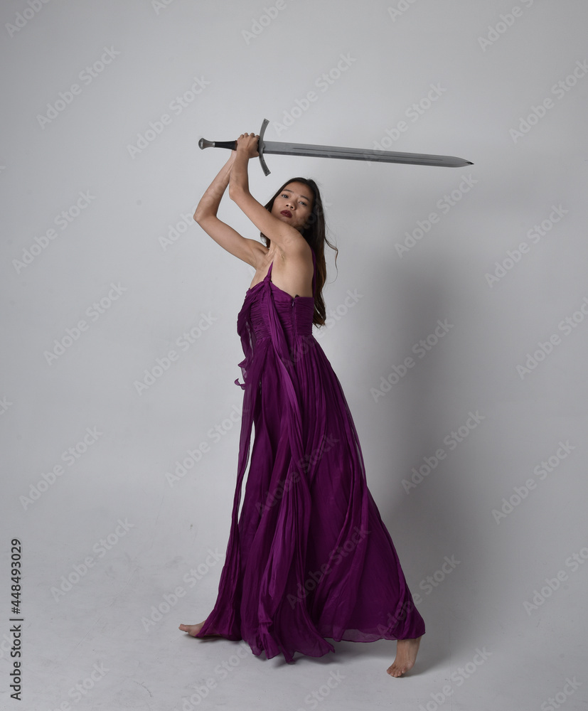 Full length portrait of pretty brunette asian girl wearing purple ...