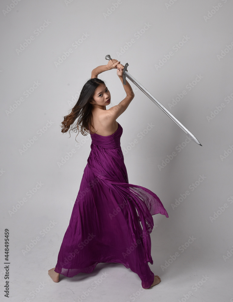 Full length portrait of pretty brunette asian girl wearing purple ...