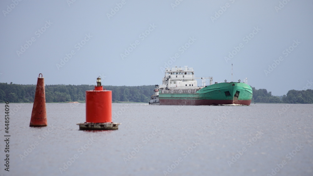 Russian green bulk cargo ship floats on the water, front side view on ...