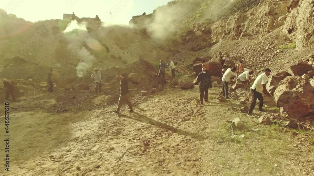 Aerial view of quarry , where working a group of miners or gold diggers ...