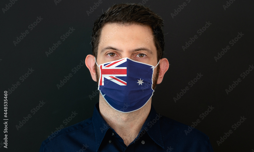 Man wearing Australian flag protective medical face mask. He looks ...