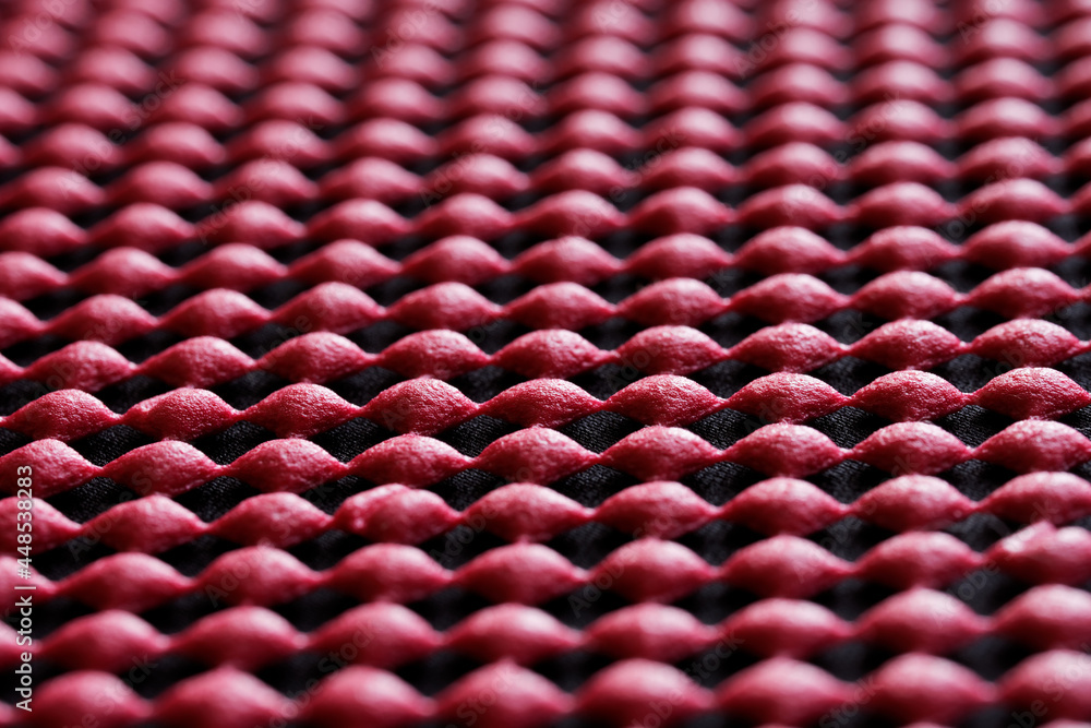 Many red miniature rubber pads on a black. Technological concept of ...