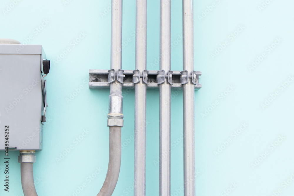 Electric cable with metal flex pipe. Installation of electrical wiring ...