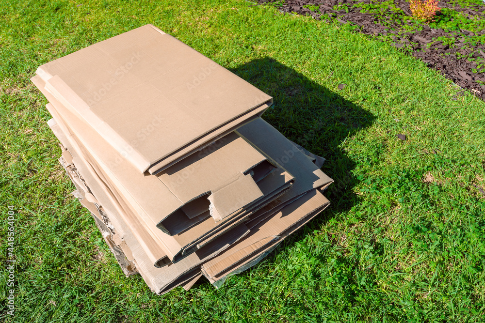 Pile of crushed cartons ready for recycling Stock Photo | Adobe Stock