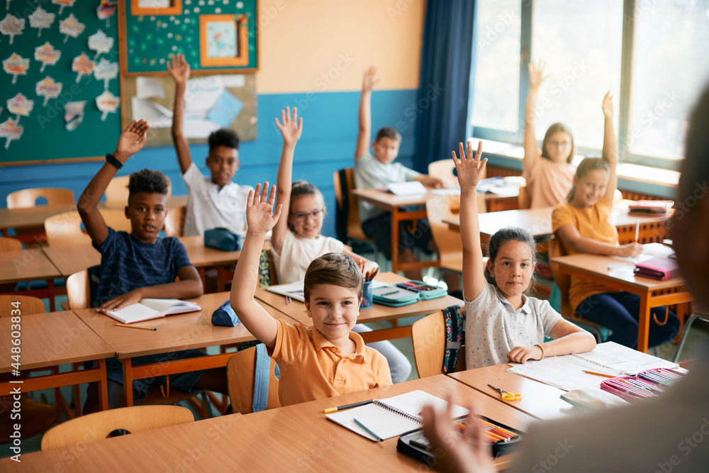 Elementary Students Raising Their Hands