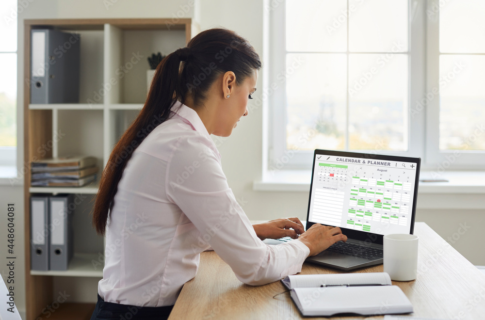 Busy female secretary at desk checks smart virtual electronic visual ...