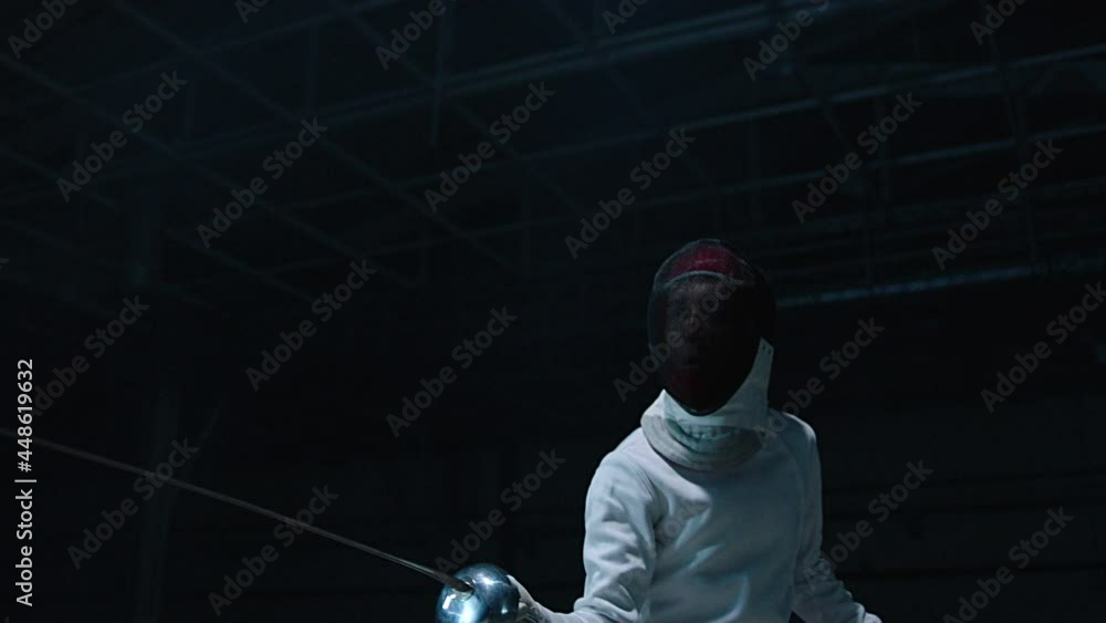 Vidéo Stock Professional fencer in protective uniform practicing ...