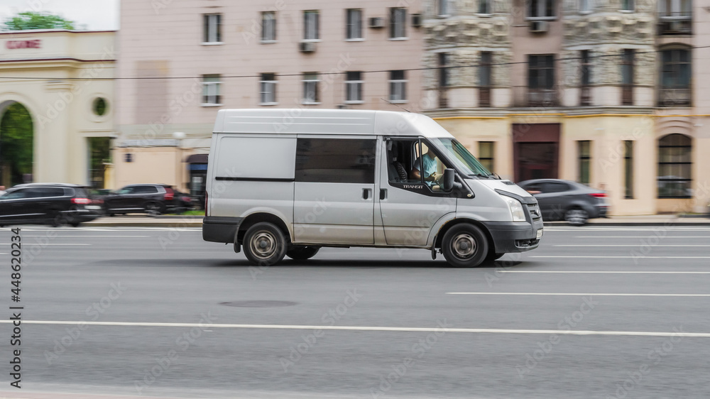 Ford Transit Third generation in the city street. Side view of white ...