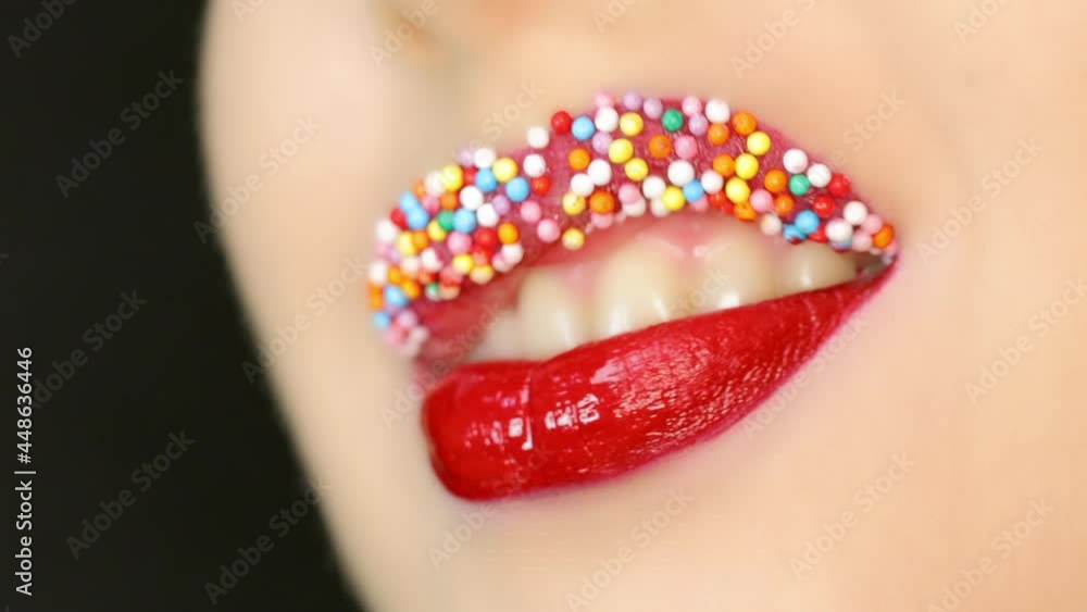 Closeup of a beautiful woman lips with beautiful colorful make up ...