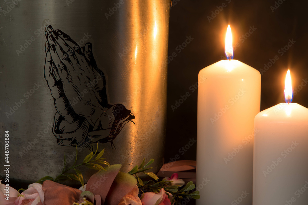 Metal urn with ashes of a dead person on a funeral. Sad grieving moment ...