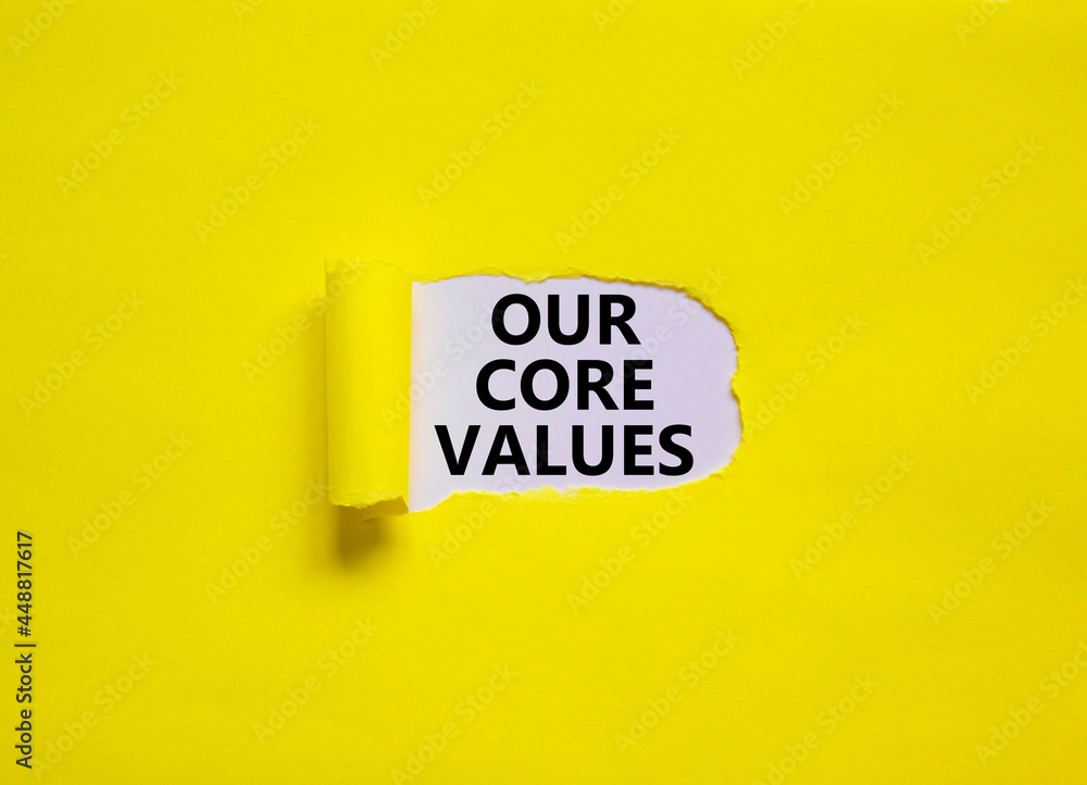 Our core values symbol. Words 'Our core values' appearing behind torn ...