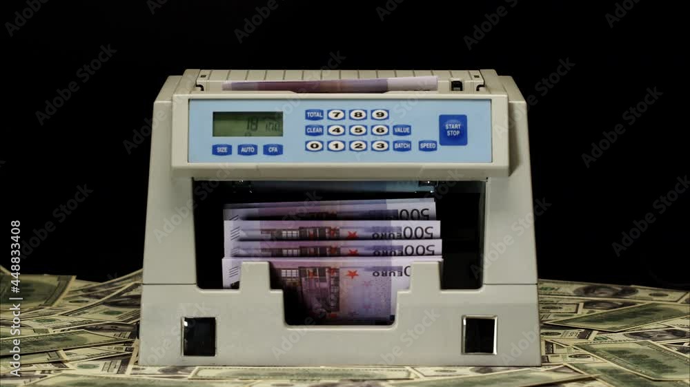 Calculating machine for money counting five hundred euro close-up ...