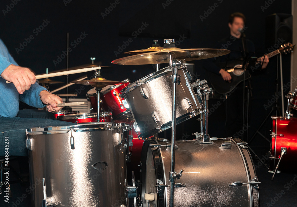 Male drum player hands holding cymbals with both hands and sticks ...