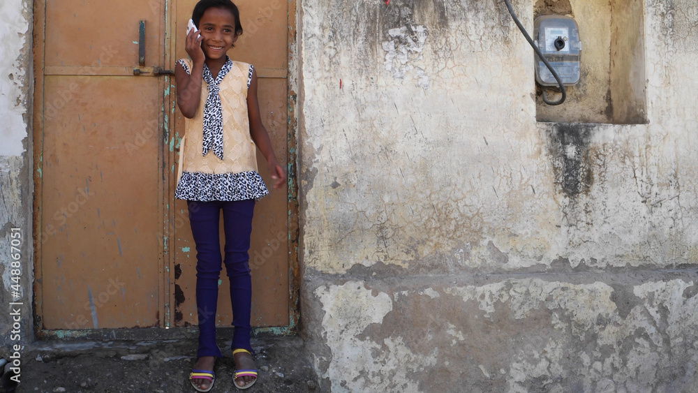 Cute happy kid talking on the phone Stock Photo | Adobe Stock