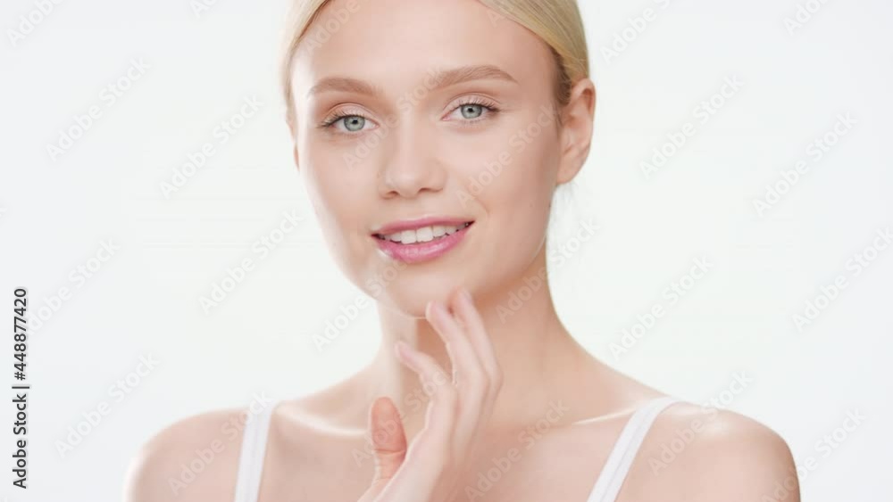 Gorgeous slim Caucasian young woman with long golden hair in ponytail ...
