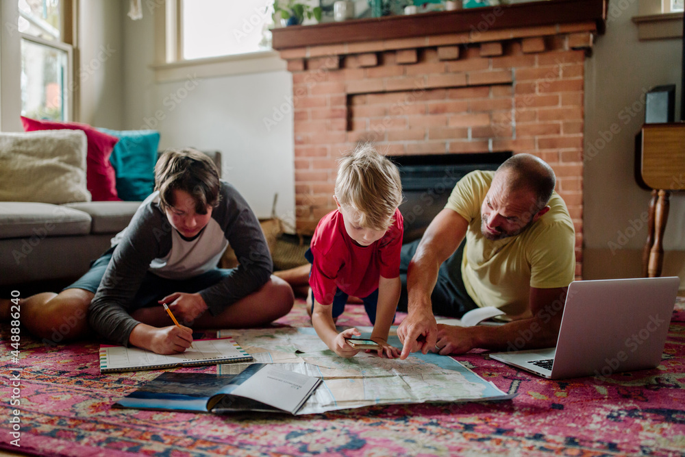 Dad and boys planning trip Stock Photo | Adobe Stock