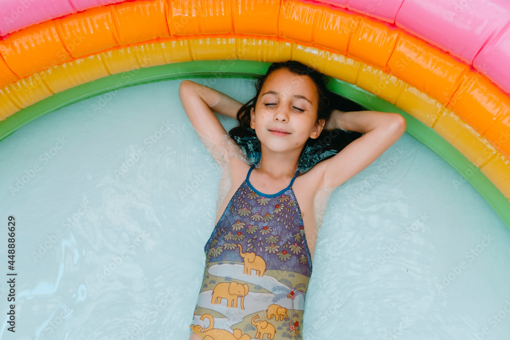 Little girl freshen up inside inflatable swimming pool Stock Photo ...