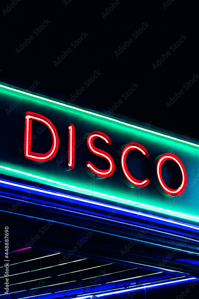 Illuminated red signboard of Disco Stock Photo | Adobe Stock