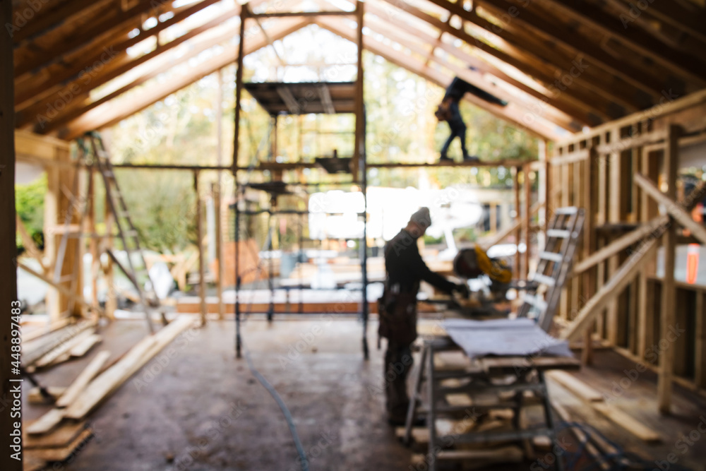Blurry construction carpenters in building Stock Photo | Adobe Stock