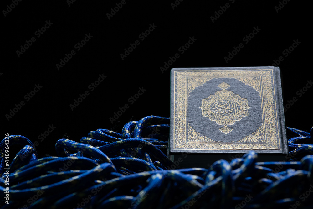 Quran in the mosque - open for prayers The black background of the ...