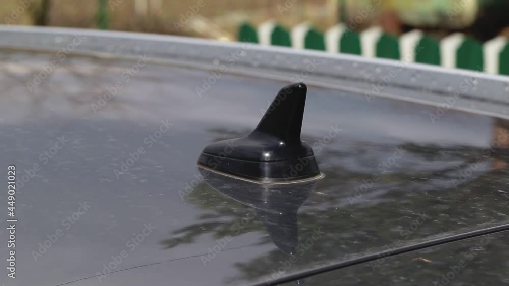 Decorative antenna on the roof of a modern car, tuning, close-up ...