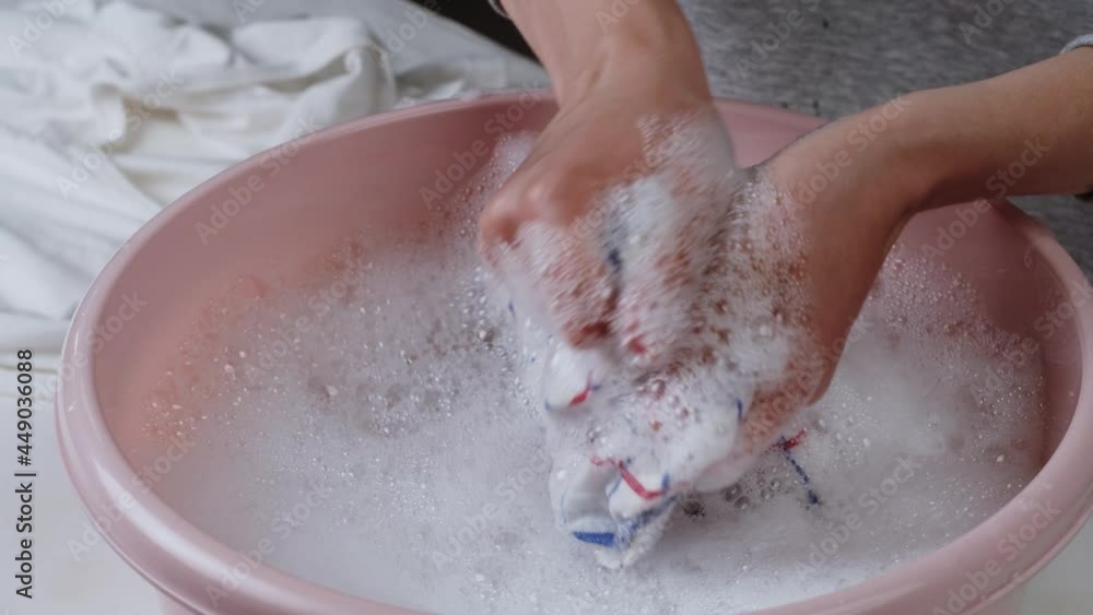 Video „Washing wet checkered towel in basin with froth and washing ...