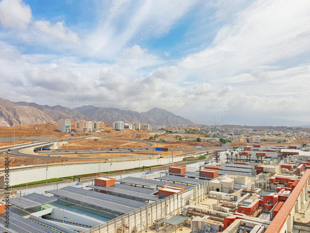 Aerial view from Mall of Oman with solar panel installation for clean ...