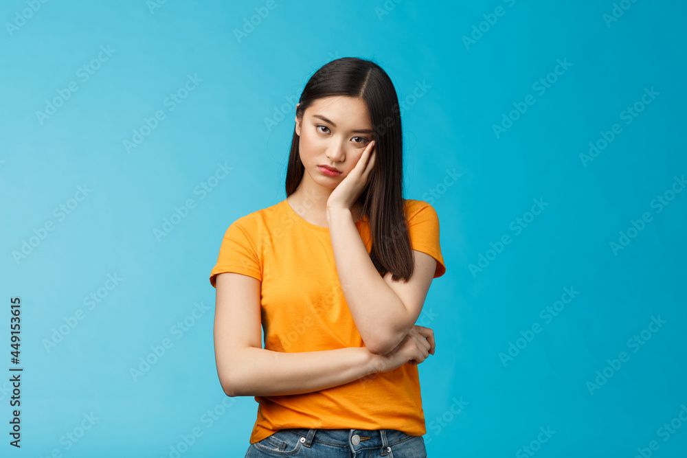 Sad bored asian female student attend boring uninteresting lecture lean ...