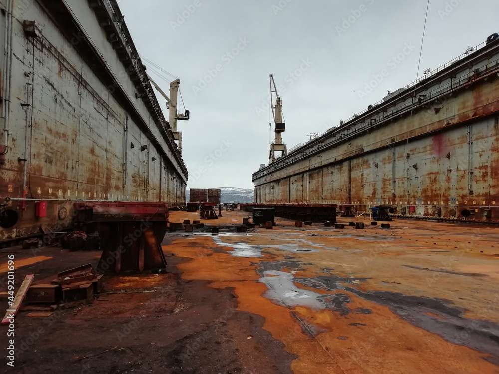 Old rusty floating dry dock. Dry docks are used for the construction ...