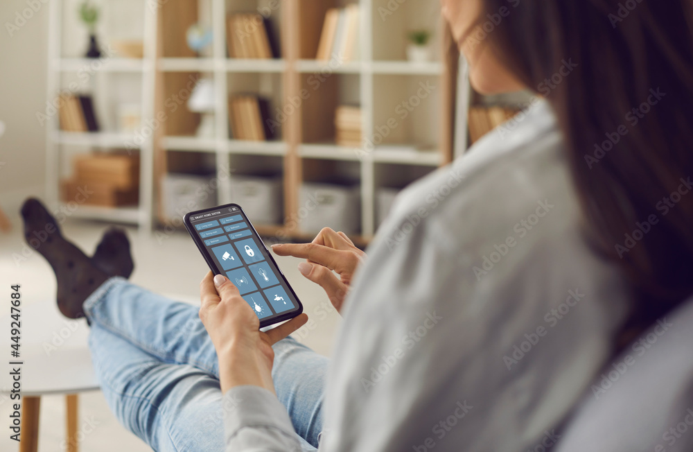 People and technology: Woman sitting in chair, holding mobile phone and ...