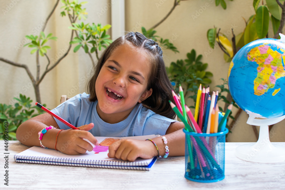 Girl Back To School. Little Girl Doing Homework In The Courtyard Of Her ...