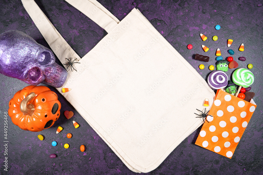 Halloween theme tote bag mockup flatlay on textured purple background ...