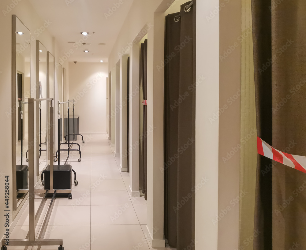 Boutique interior, fitting room in a shopping center. Empty fitting ...