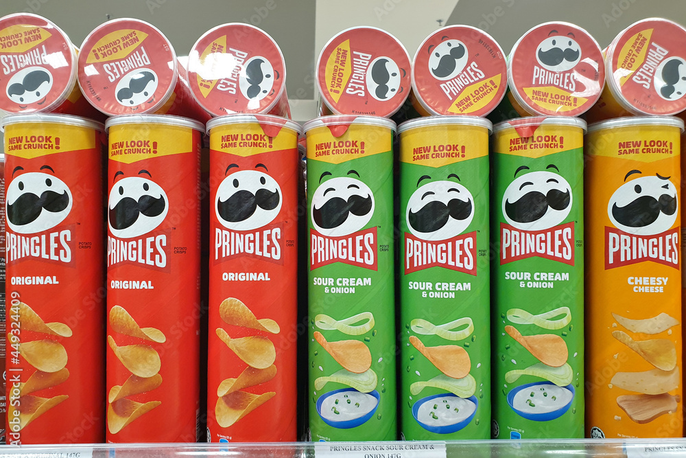 Zdjęcie Stock: Row of Pringles potato chips on the store shelf in Aeon ...