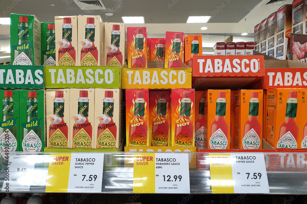 Row of Tabasco hot sauce display on store shelf in Aeon grocery store ...