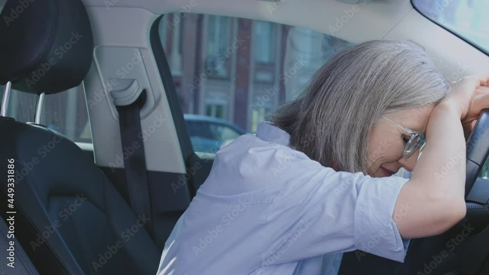 Upset senior woman has problems while driving, road accident, problems ...