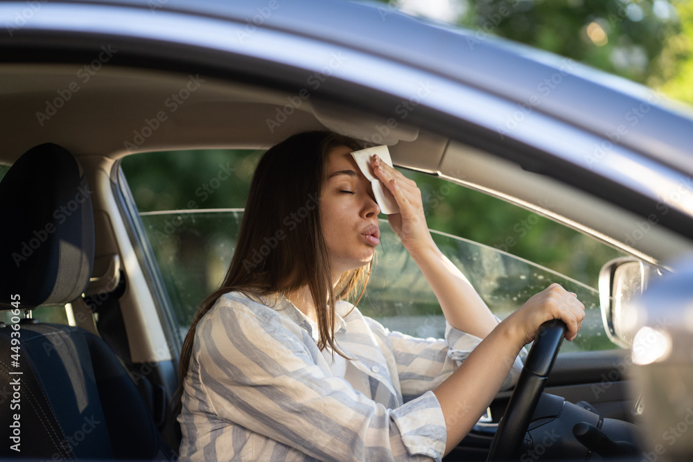 Girl driver being hot during heat wave in car, suffering from hot ...
