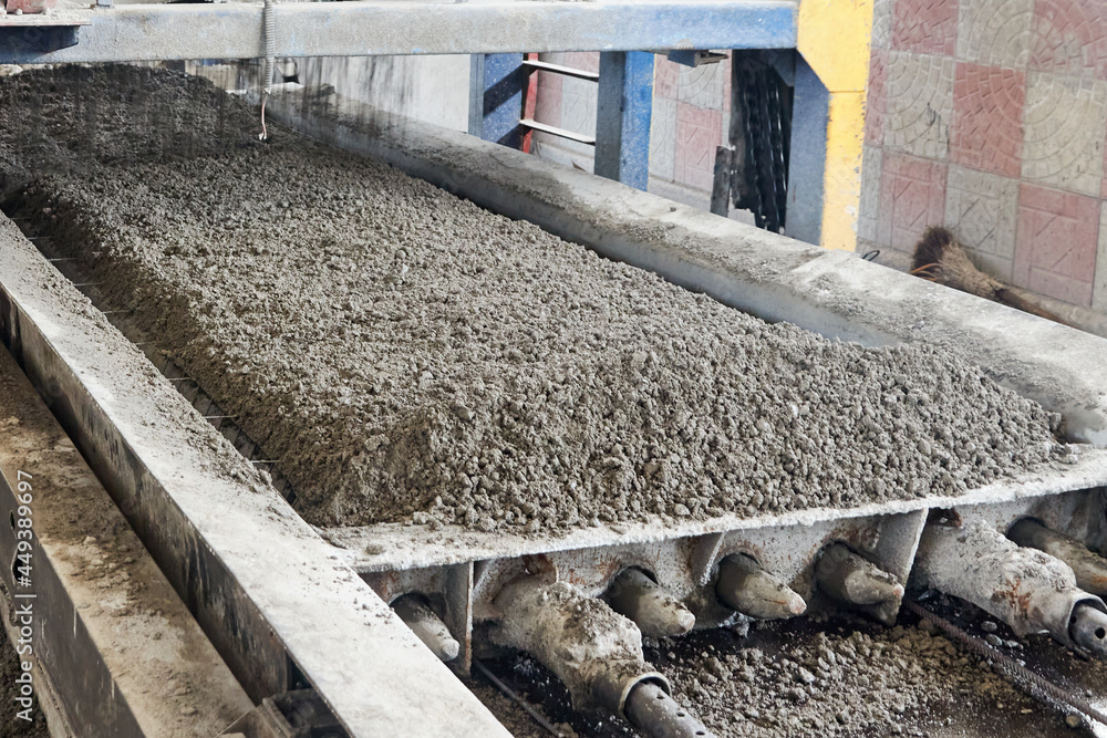 filling with concrete of form during production of floor slabs Stock ...