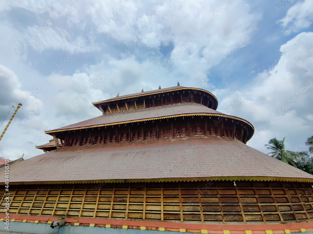 Beneath the sky is a view of an ancient Hindu temple rich in beautiful ...