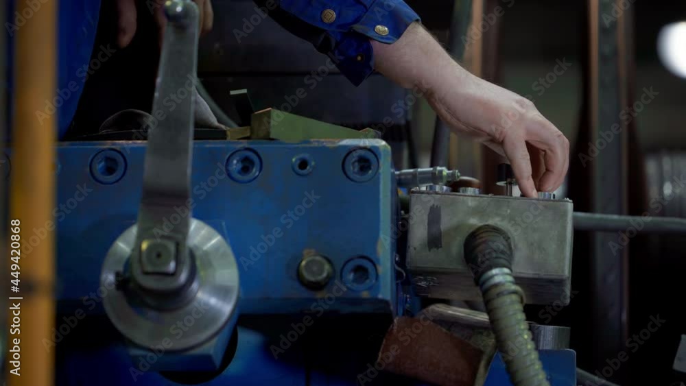 Industrial Processes at the Manufacturing Plant. A Factory Worker is ...