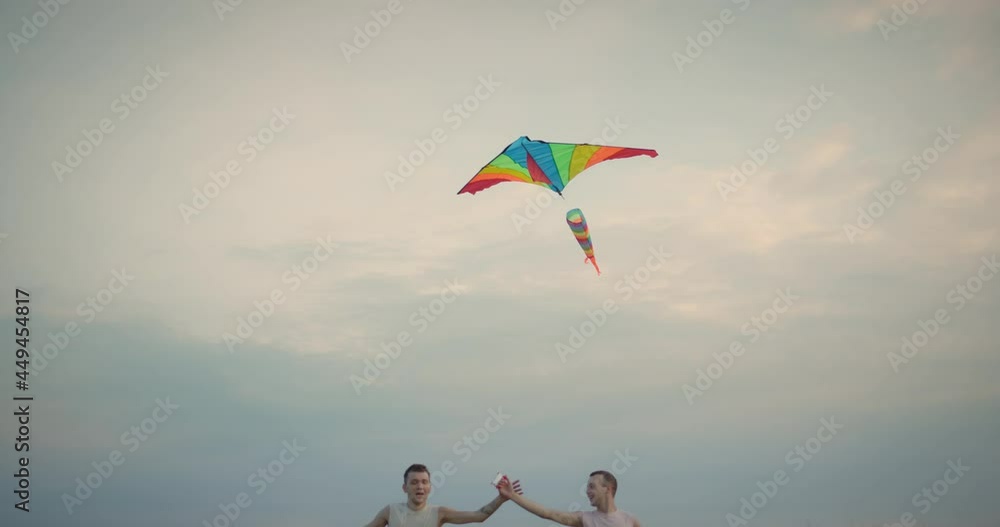 Positive Couple Guys Flying Rainbow Kite, LGBT Pride Flag in the Sky ...