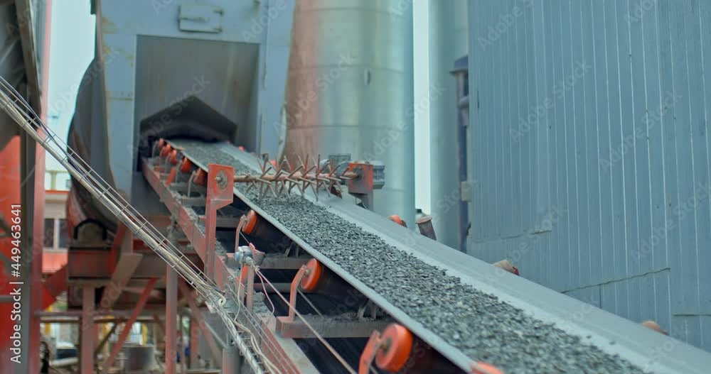 Construction conveyor belt, stones and crushed stone are lifted into ...