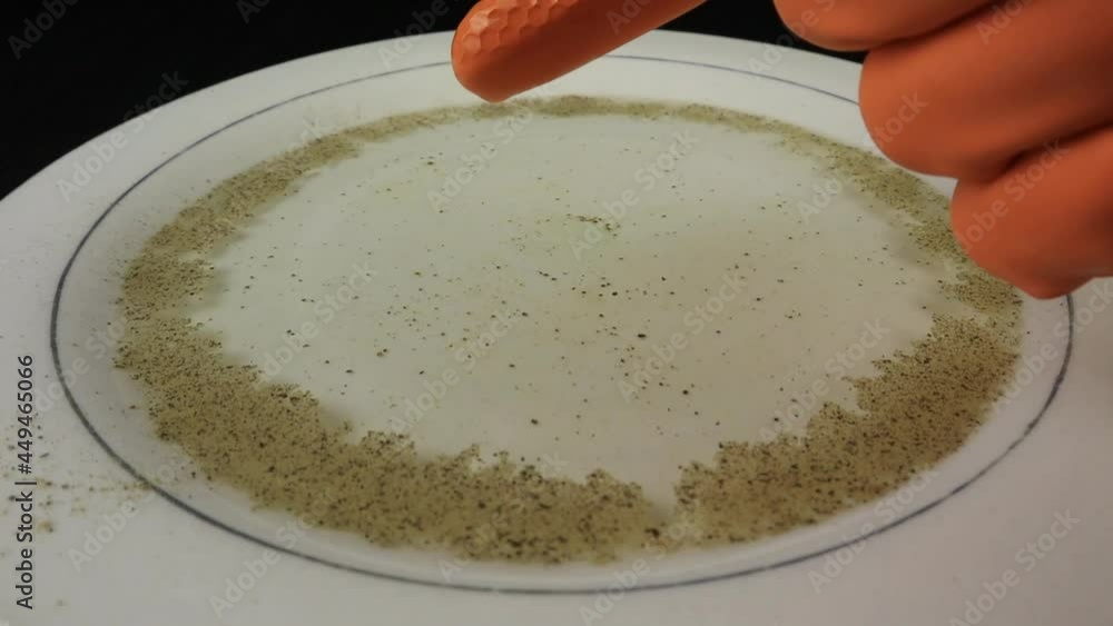 This footage shows simple science using pepper and soap as the main ...