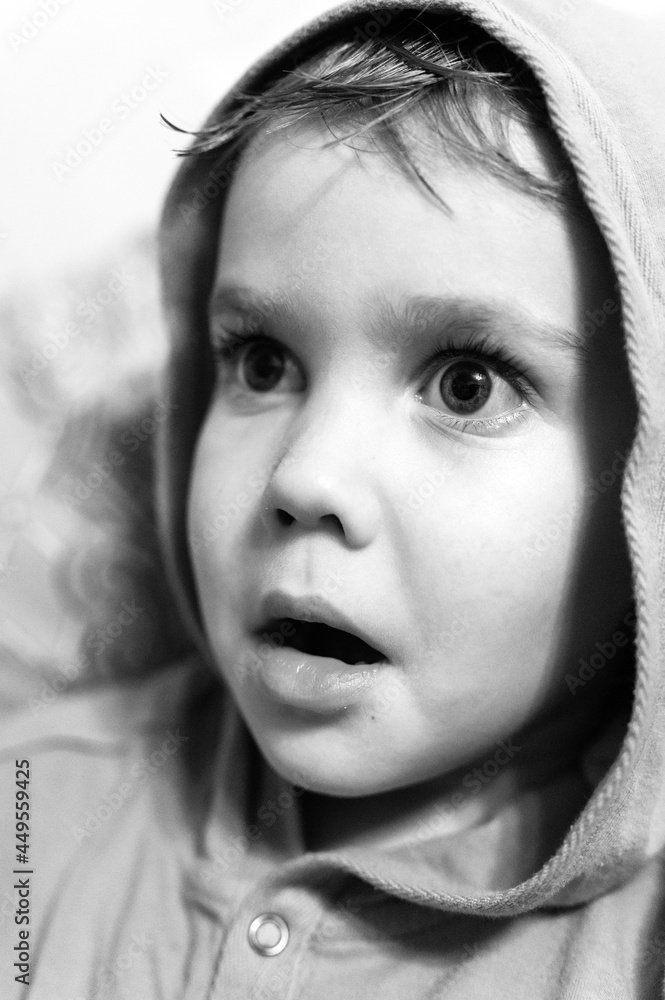 children's candid emotions on the face. portrait of a little boy with ...