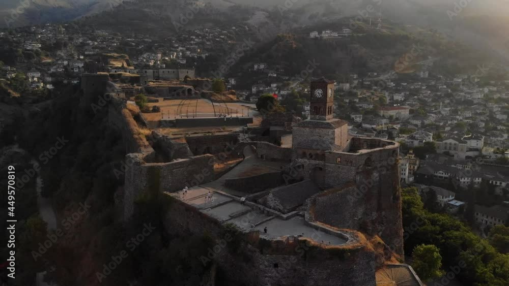 Aerial shot of old medieval castle, walls and towers at the top of the ...